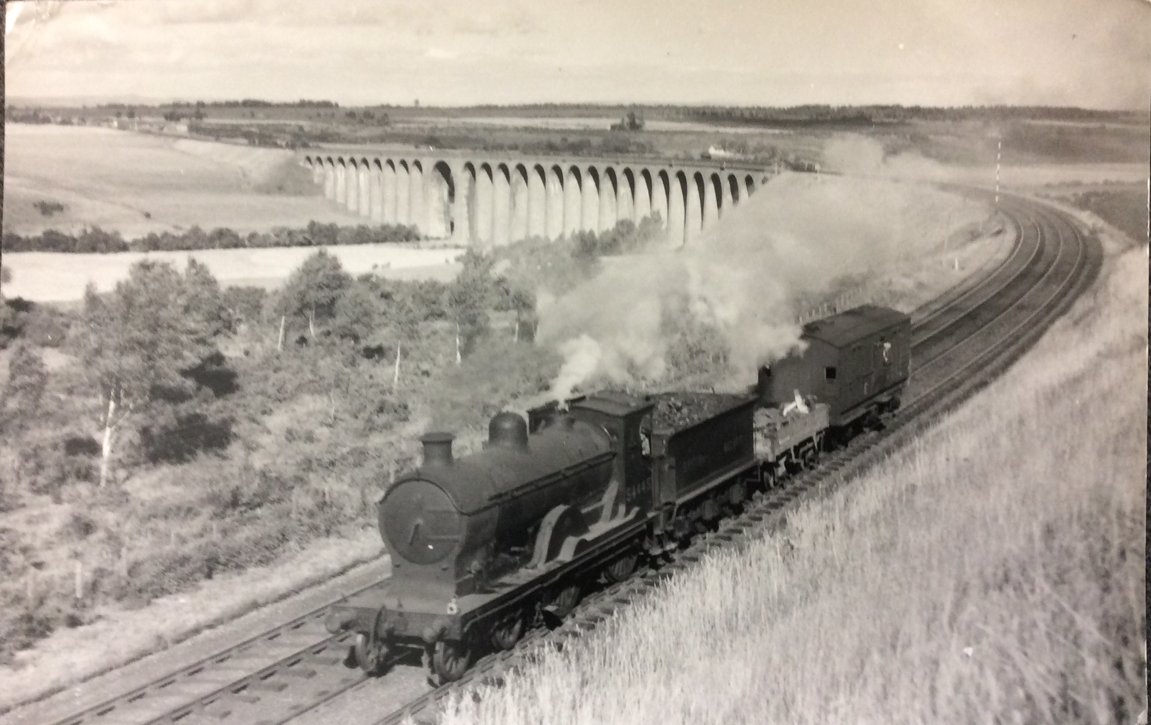 BR steam locomotive 54445 with up permanent way train passing Culloden ...